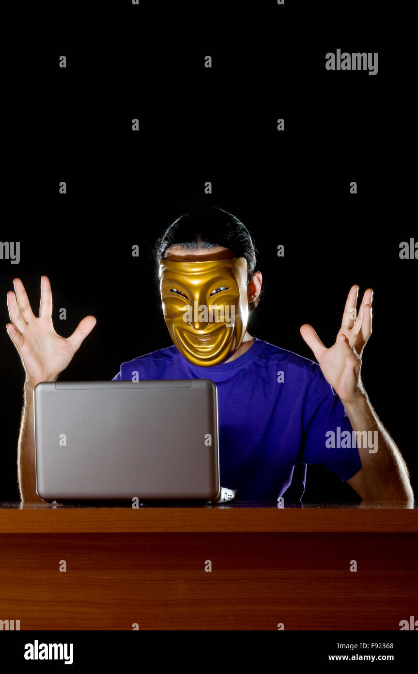 Hacker sitting in dark room Stock Photo - Alamy