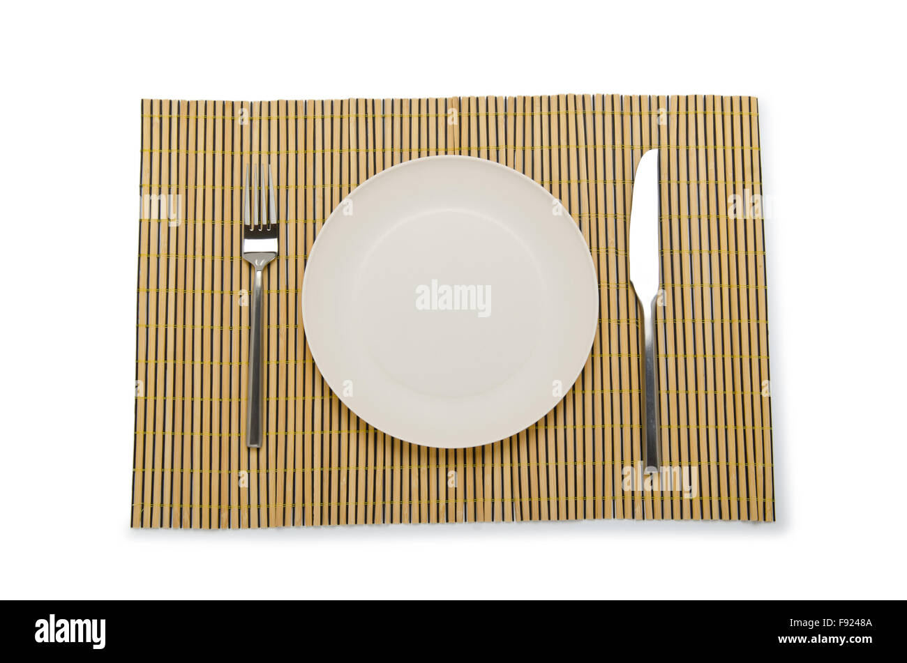 Plate and utensils served on table Stock Photo - Alamy