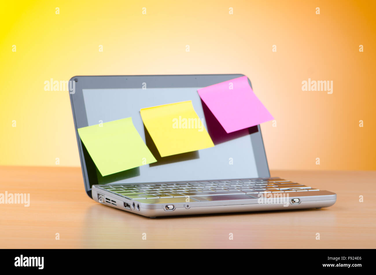Netbook with reminder notes Stock Photo - Alamy