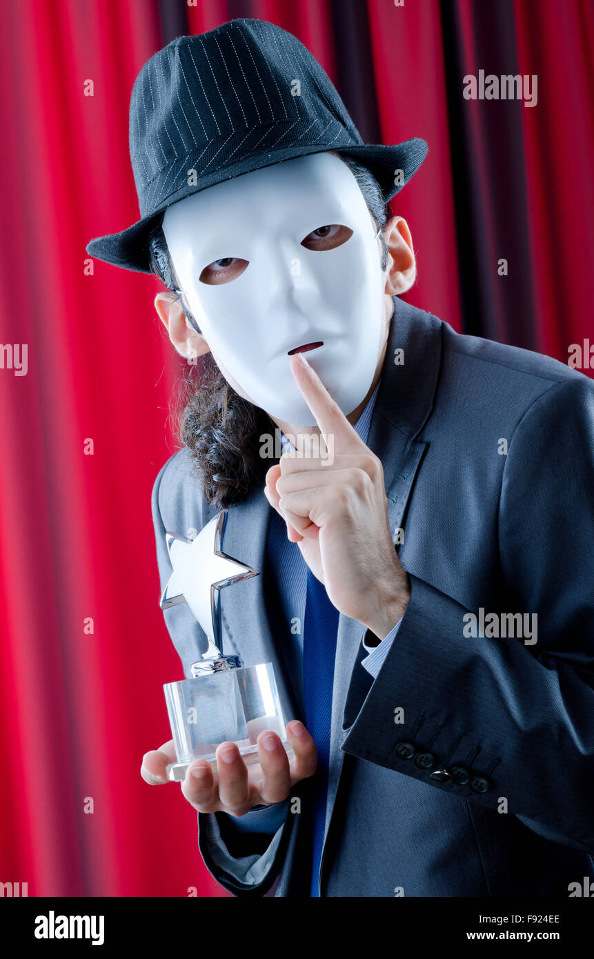 Man receiving award in mask Stock Photo - Alamy