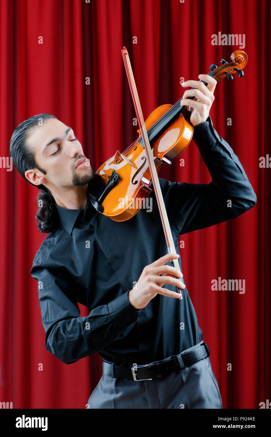 Violin player playing the intstrument Stock Photo - Alamy
