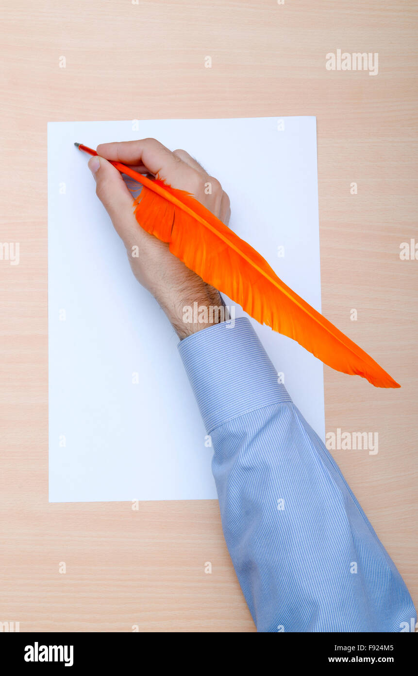 Man with quill writing Stock Photo - Alamy