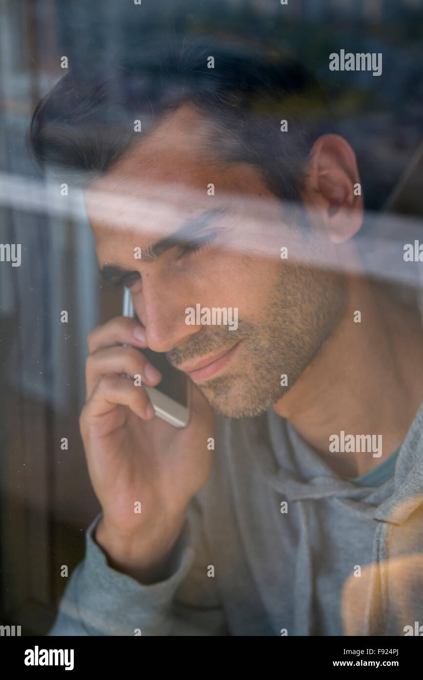 Young man with mobile phone Stock Photo - Alamy