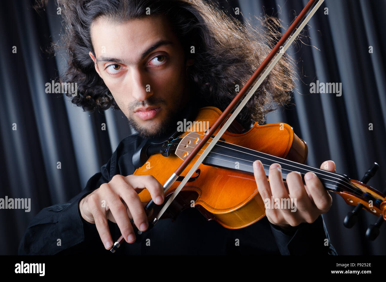 Young violin player playing Stock Photo - Alamy