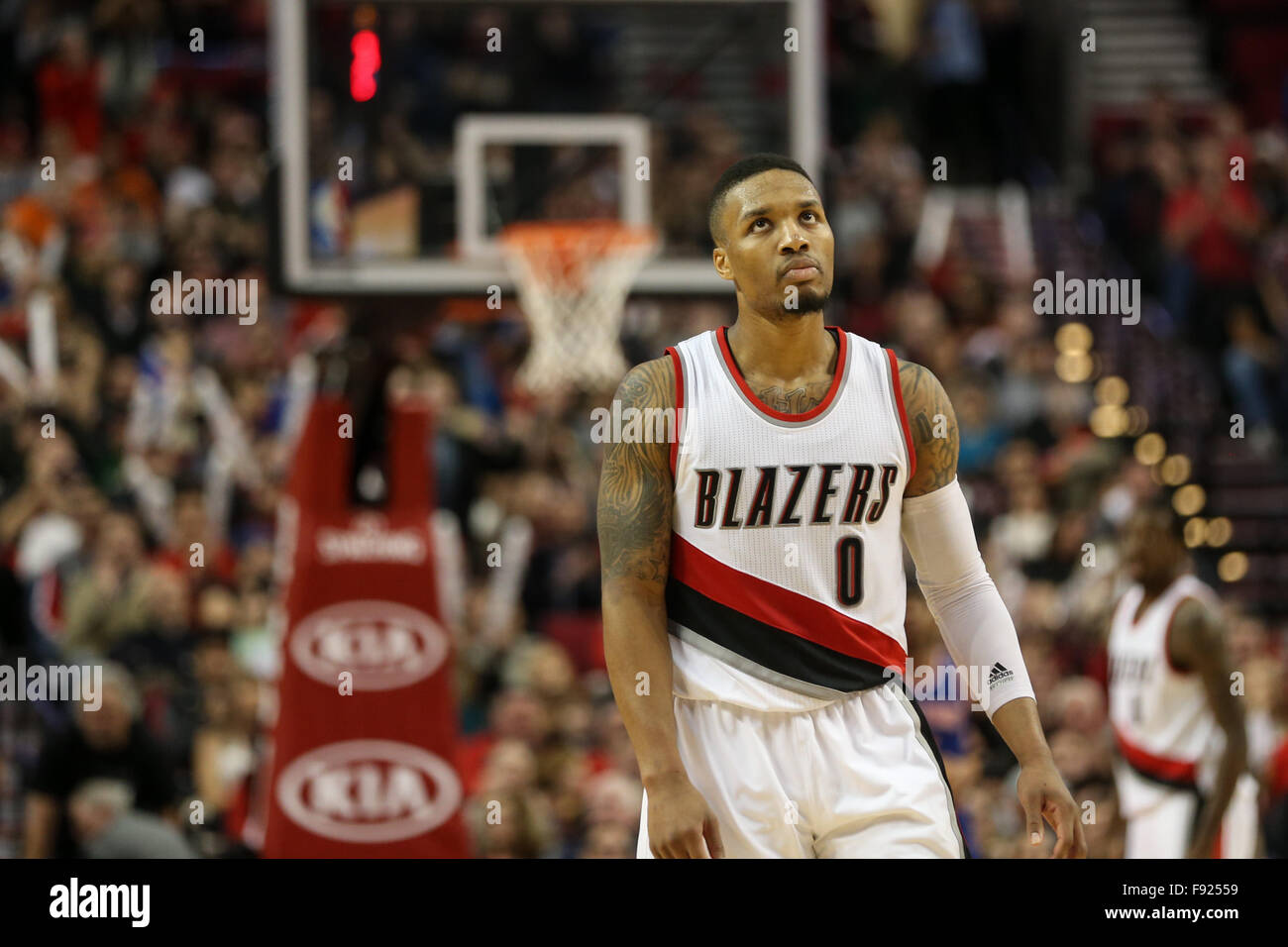 Portland, Oregon, USA. 12th December, 2015. DAMIAN LILLARD (0) reacts ...