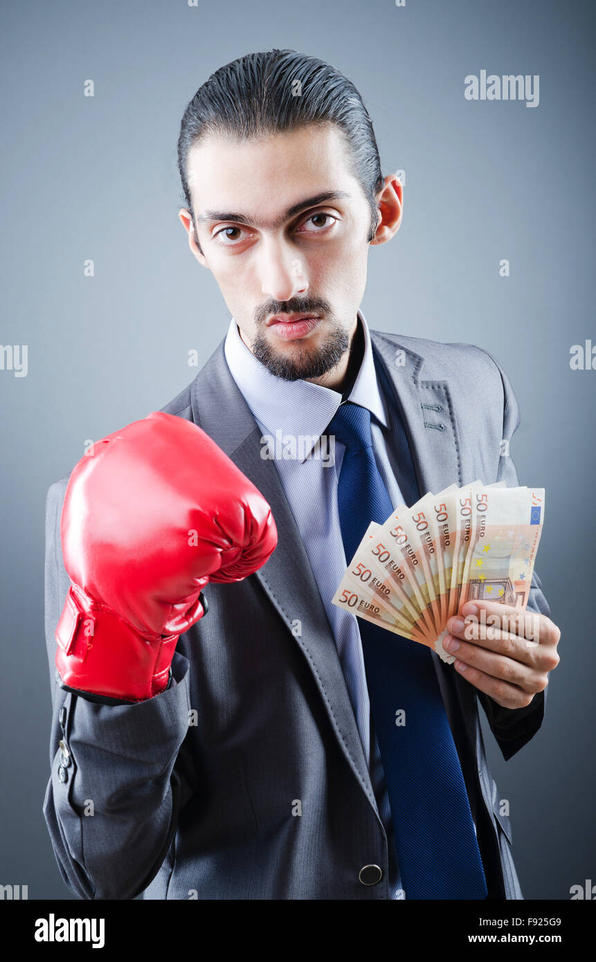 Man with boxing gloves and money Stock Photo - Alamy