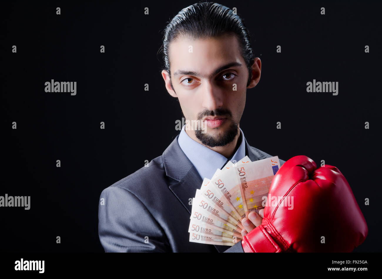 Man with boxing gloves and money Stock Photo - Alamy