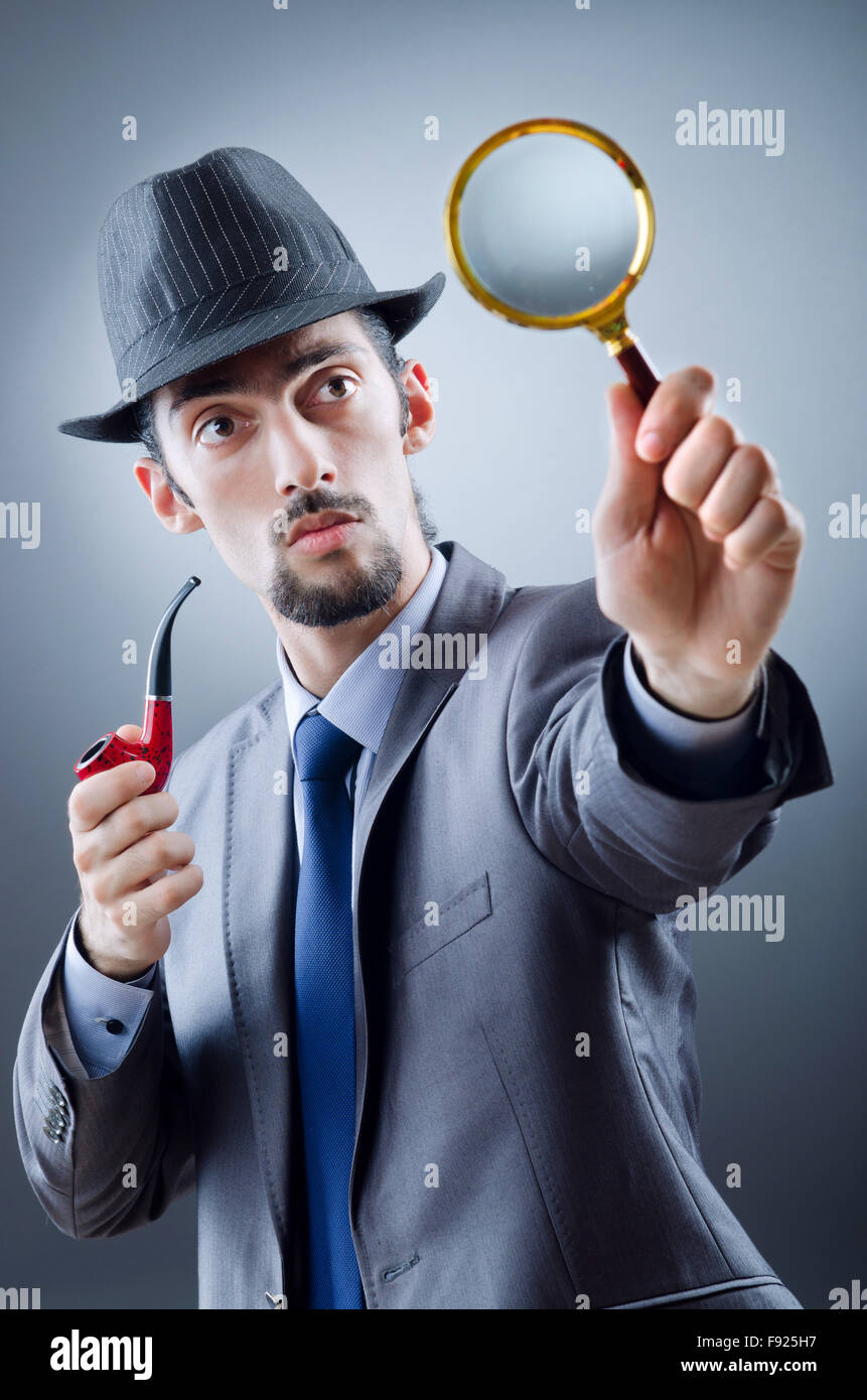 Detective with the smoking pipe Stock Photo - Alamy