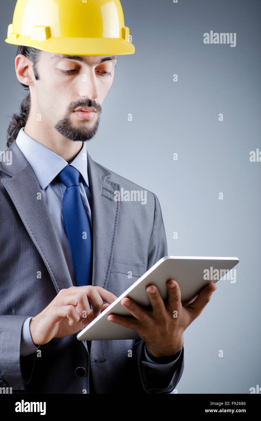 Construction worker working on tablet Stock Photo - Alamy