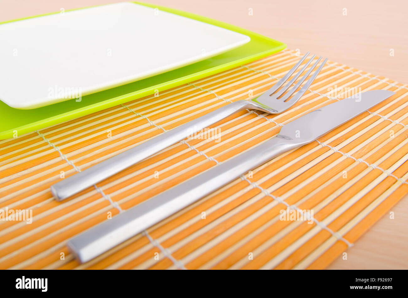 Served table with fork and knife Stock Photo - Alamy