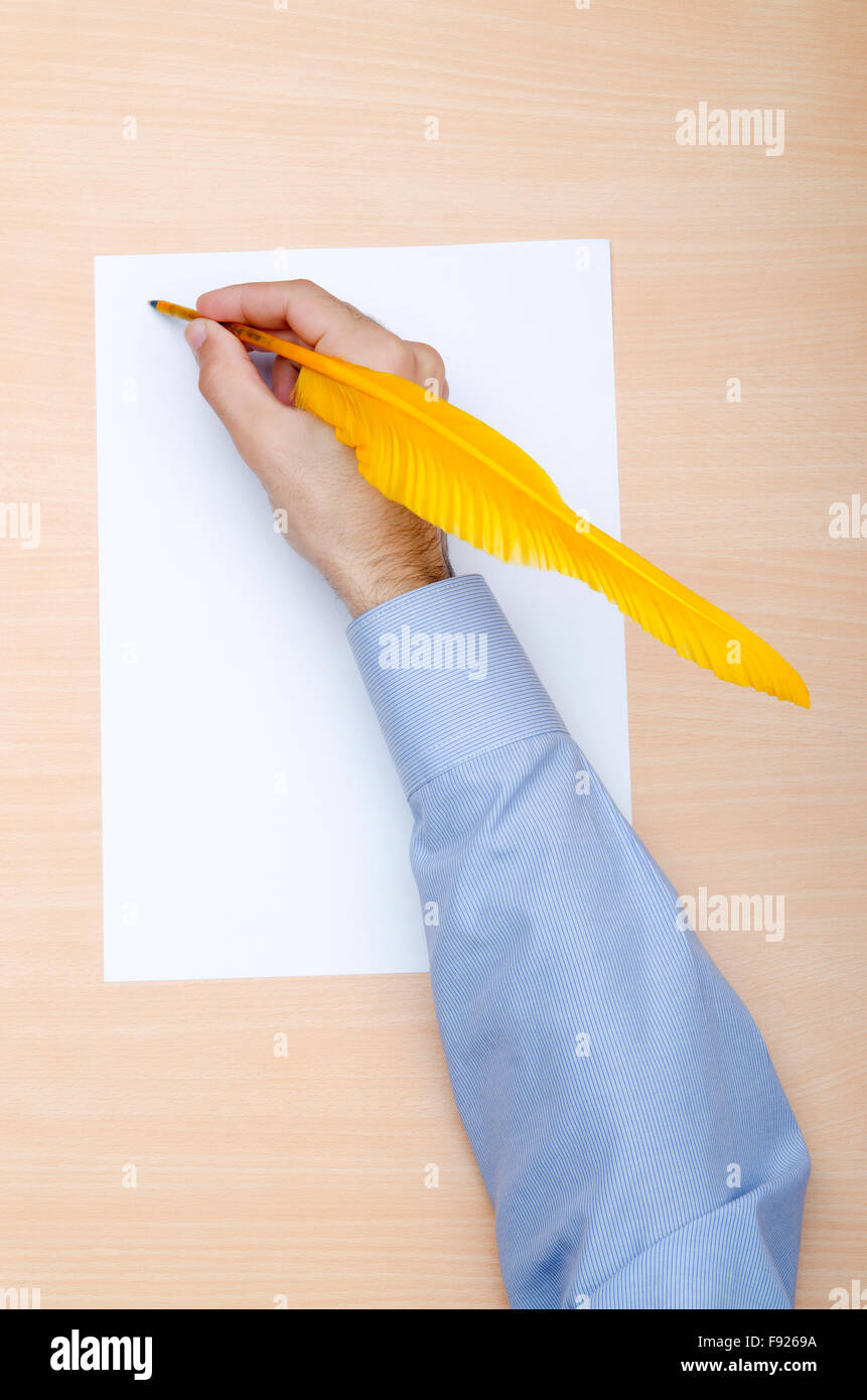 Man with quill writing Stock Photo - Alamy