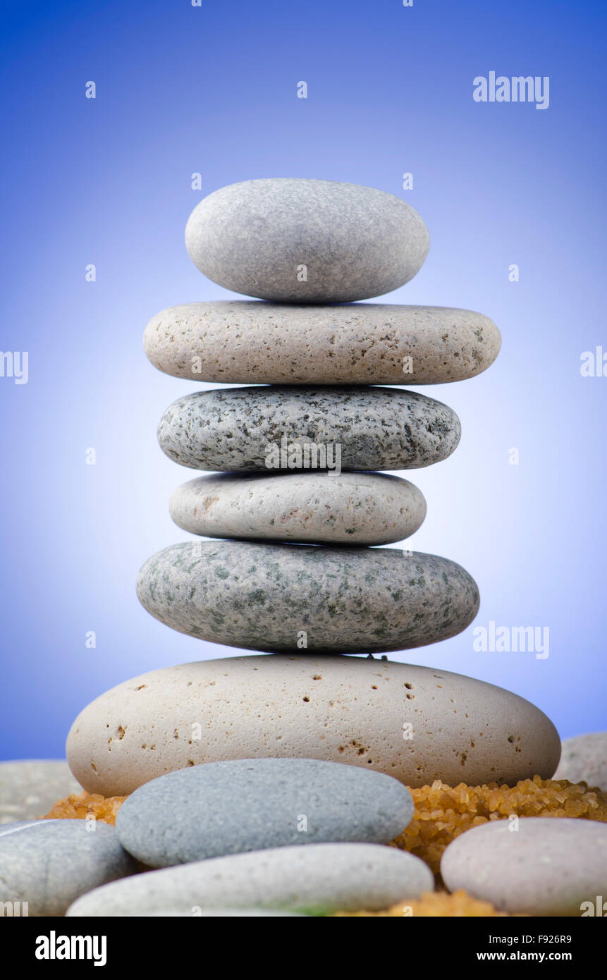 Balanced pebbles with colour background Stock Photo - Alamy