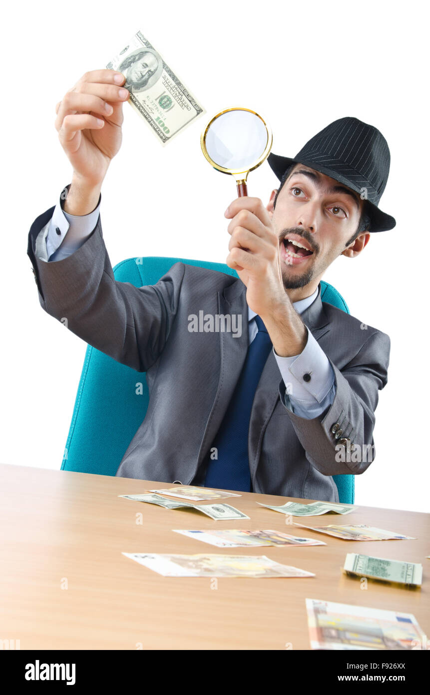 Detective detecting fake dollar banknotes Stock Photo - Alamy