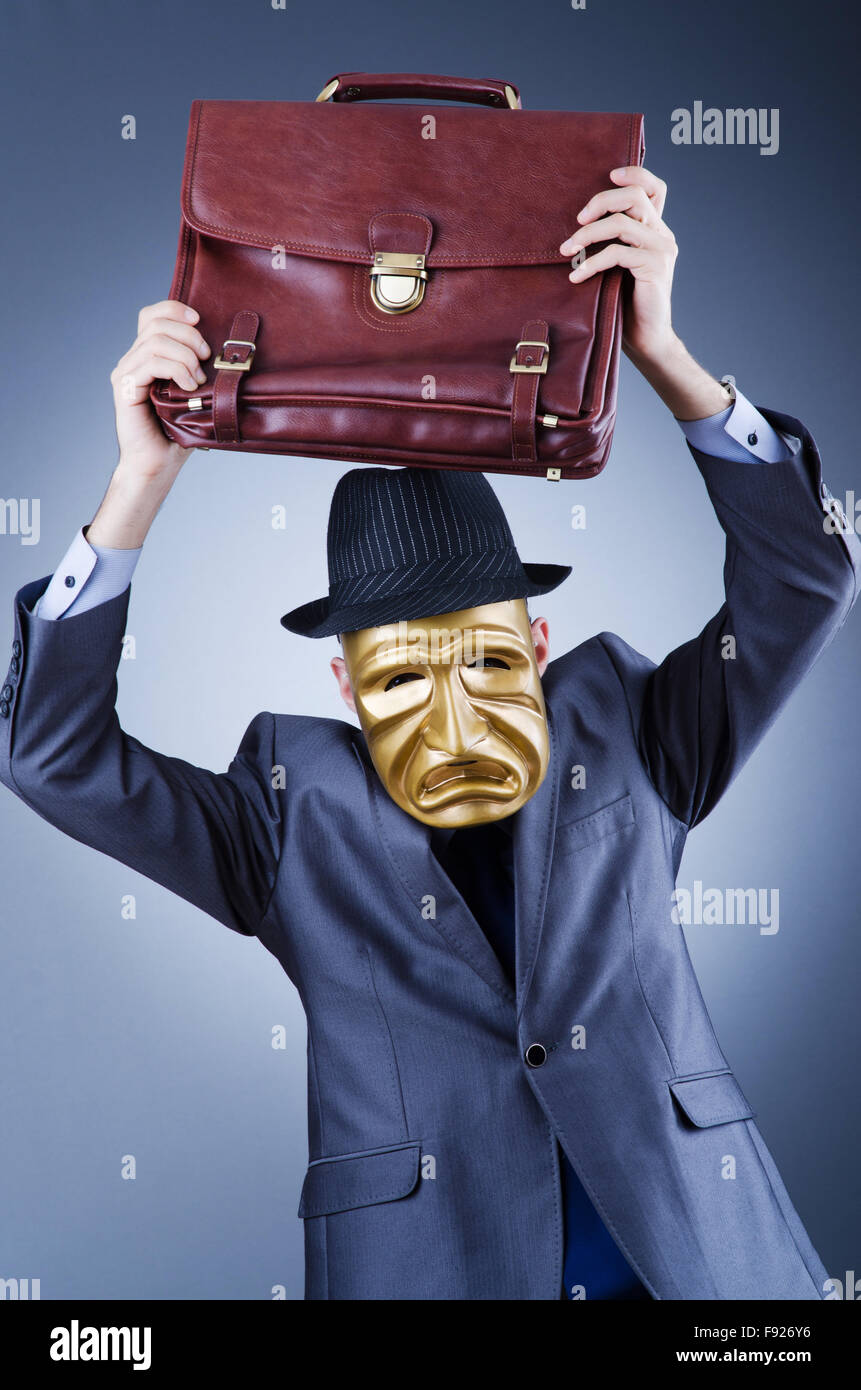 Businessman with mask concealing his identity Stock Photo - Alamy