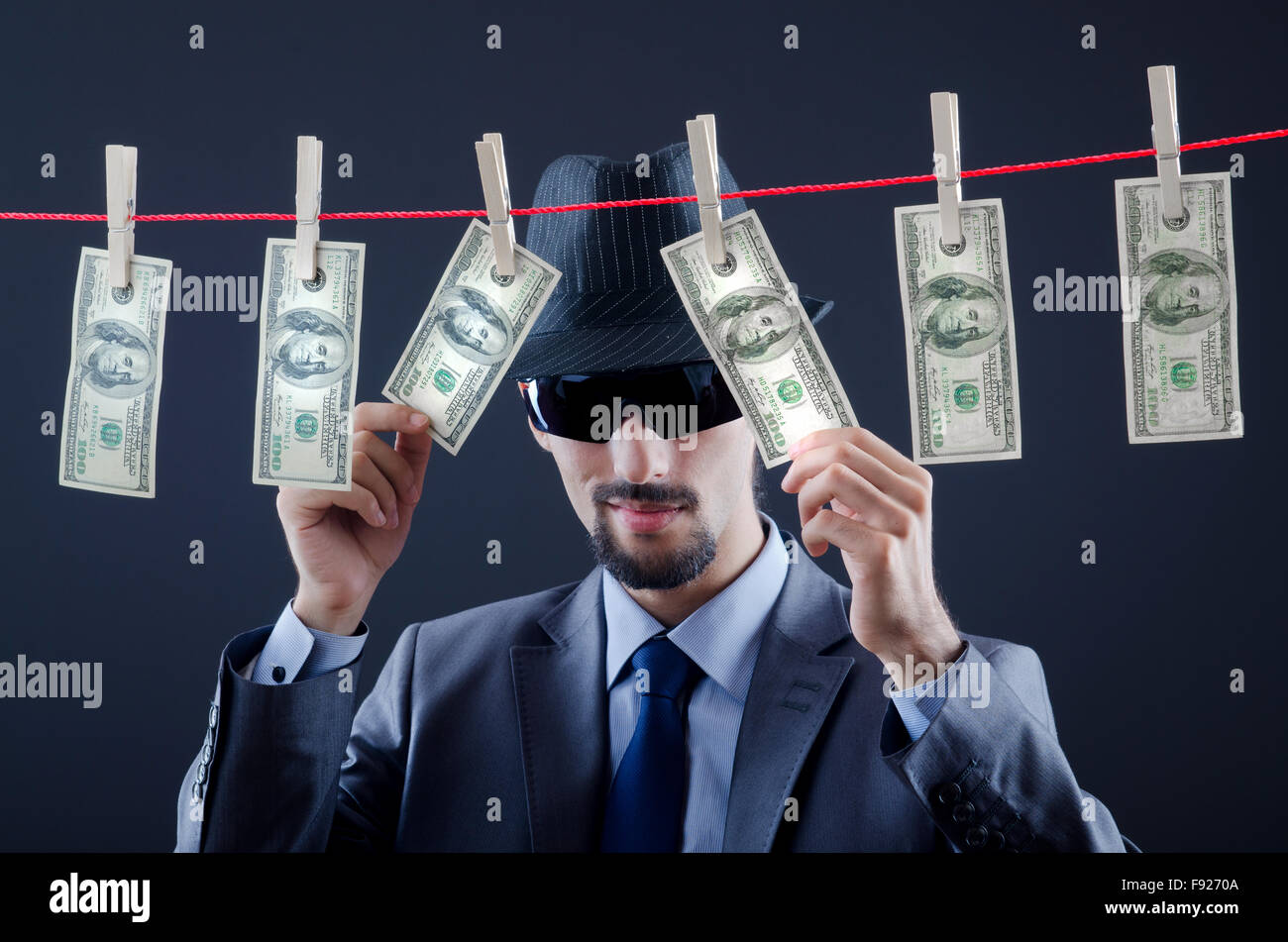 Money laundering dollars bills greed hi-res stock photography and ...