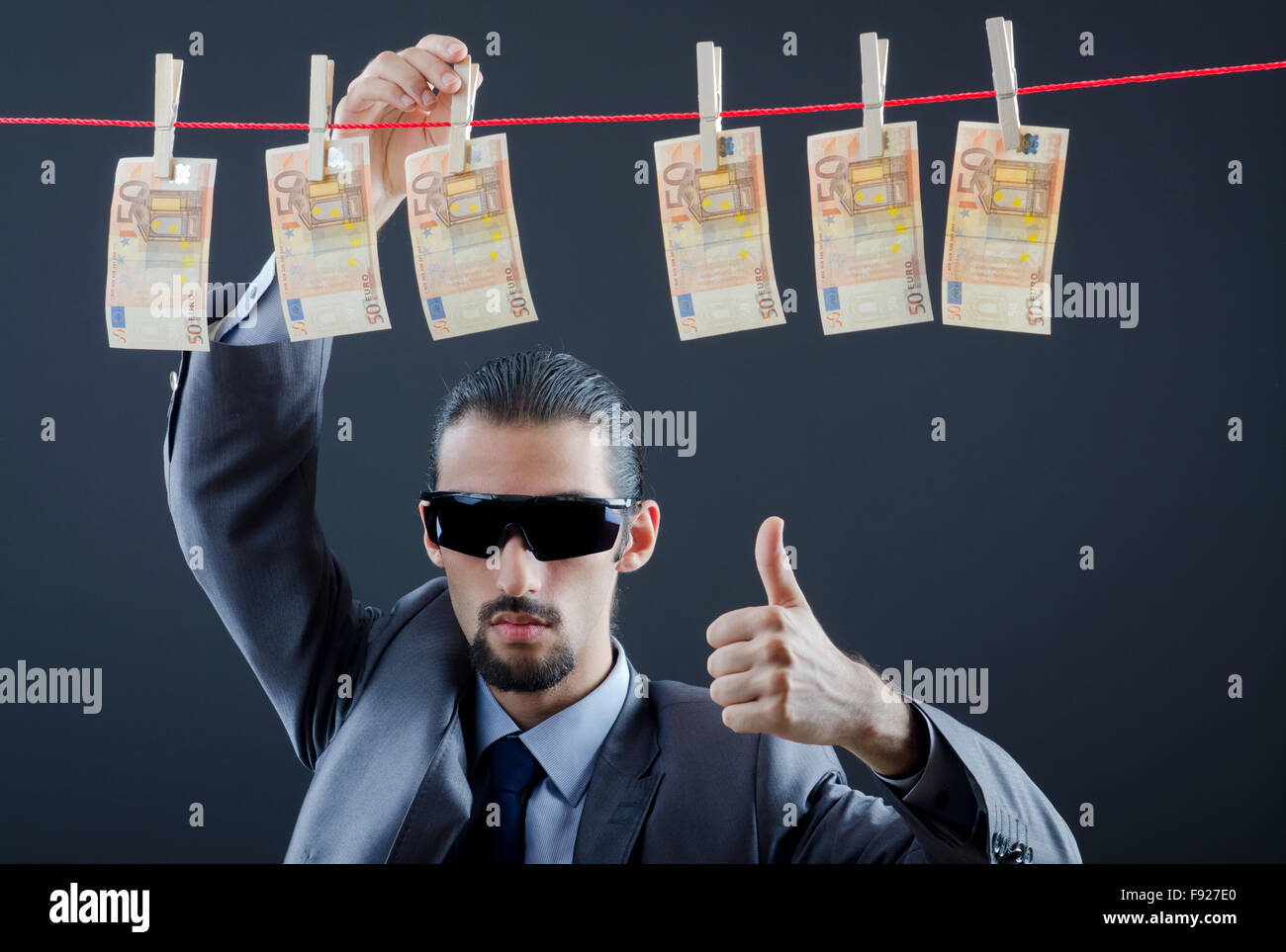 Money laundering dollars bills greed hi-res stock photography and ...