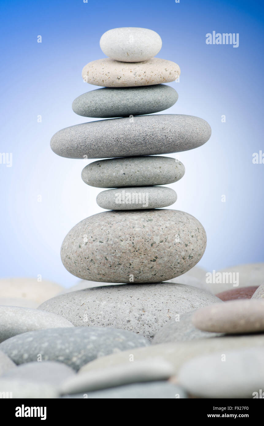 Pebbles stack against gradient background Stock Photo - Alamy