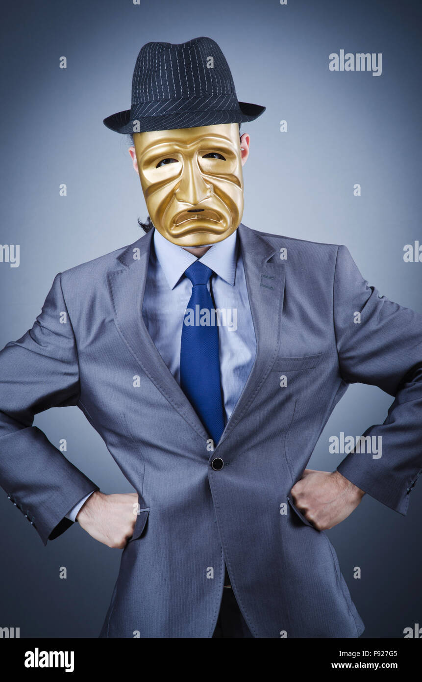 Businessman with mask concealing his identity Stock Photo - Alamy