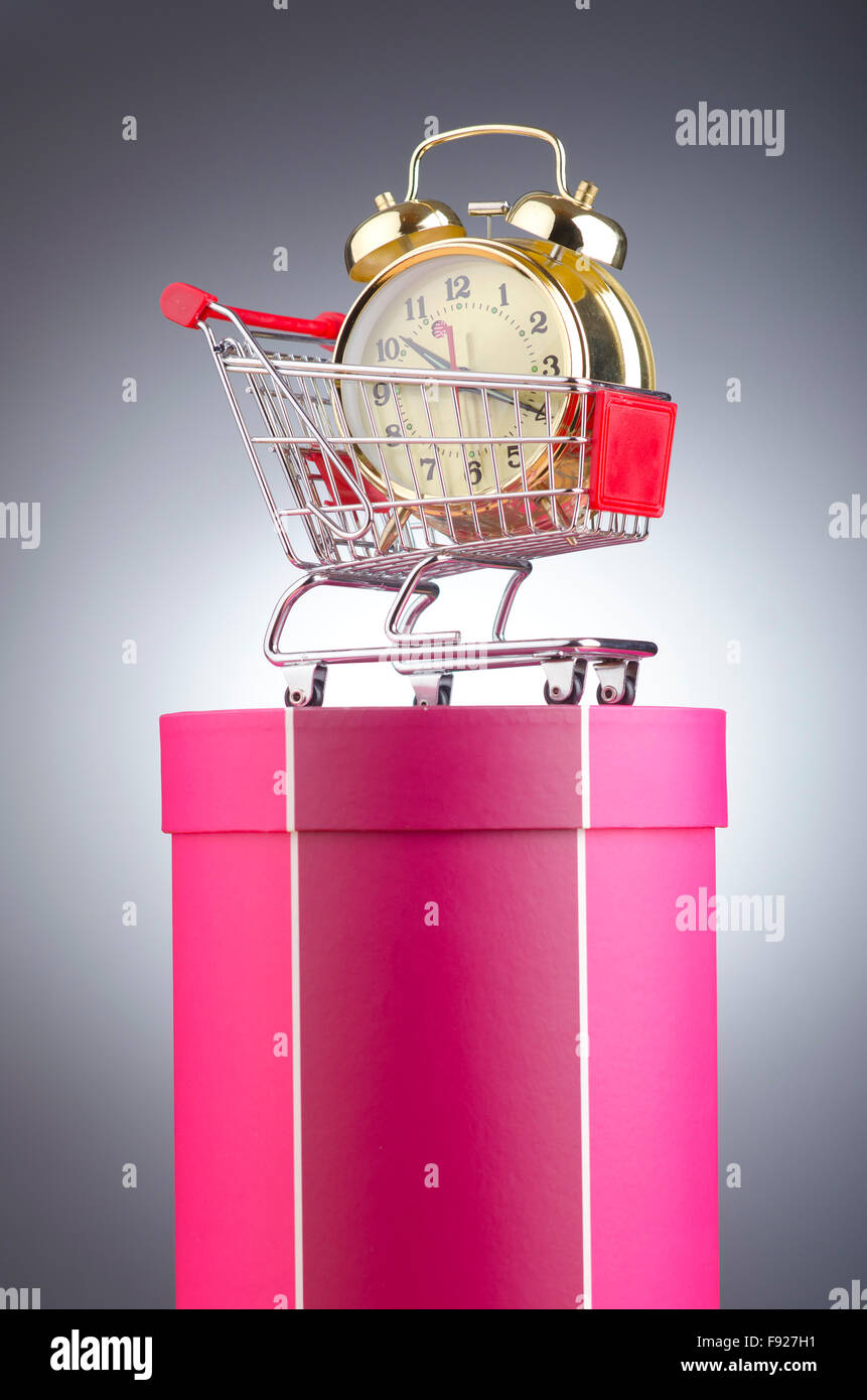 Buying time concept with clock and shopping cart Stock Photo - Alamy