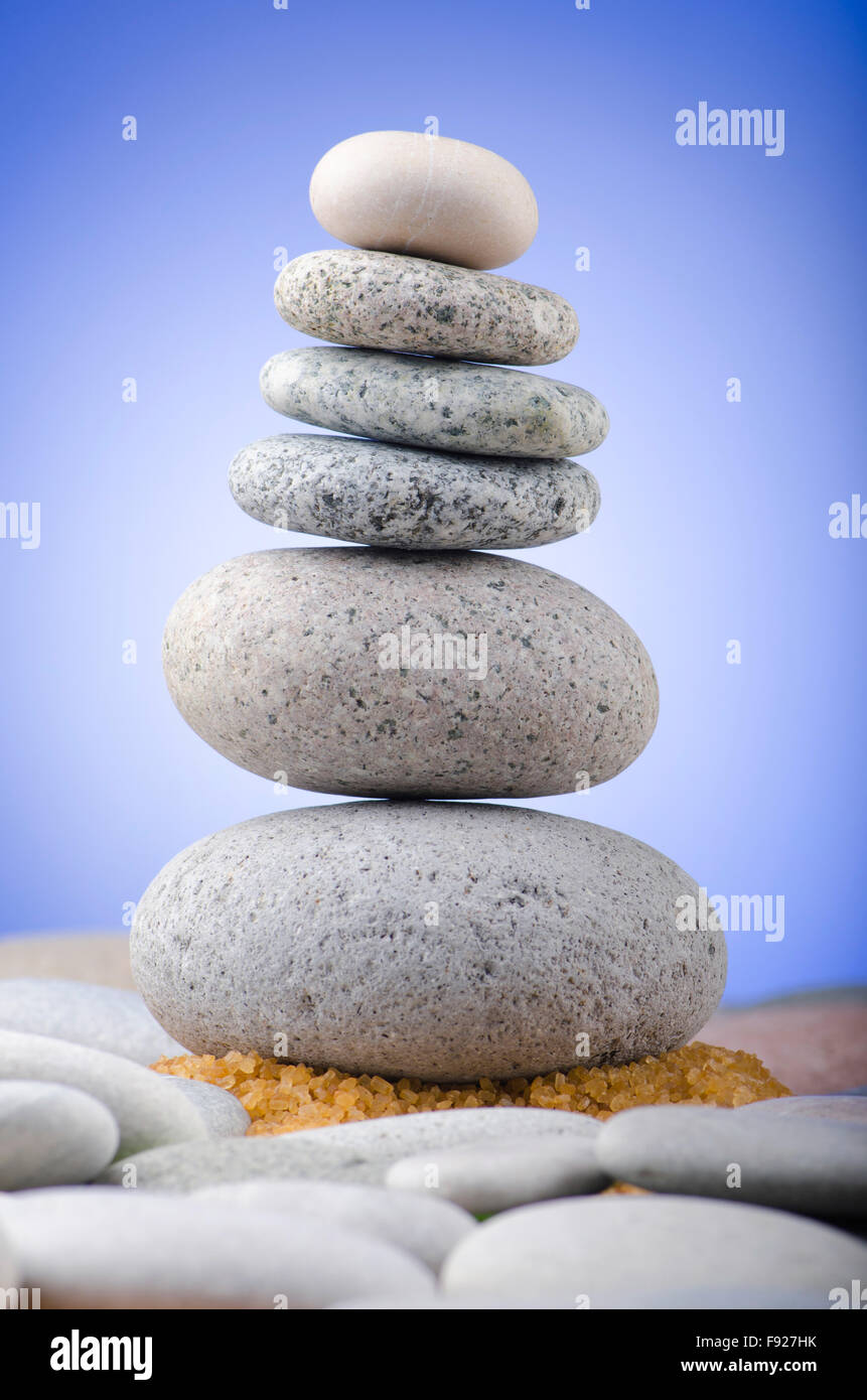 Balanced pebbles with colour background Stock Photo - Alamy