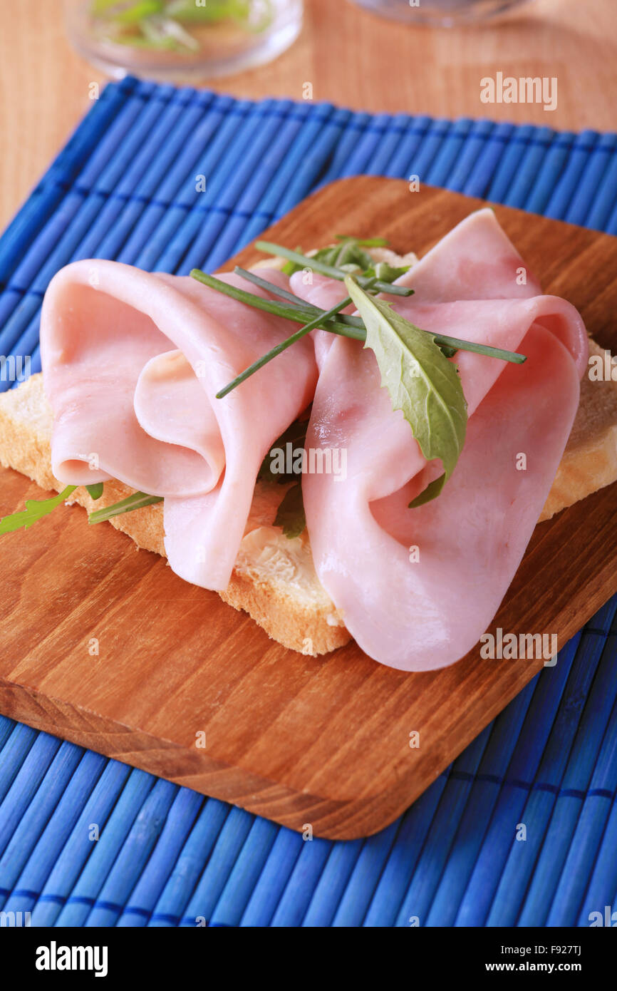Open faced ham sandwich with greens and chives Stock Photo - Alamy
