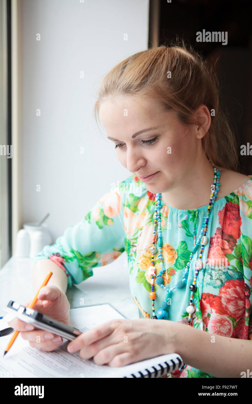 Blond young woman with mobile phone hi-res stock photography and images ...