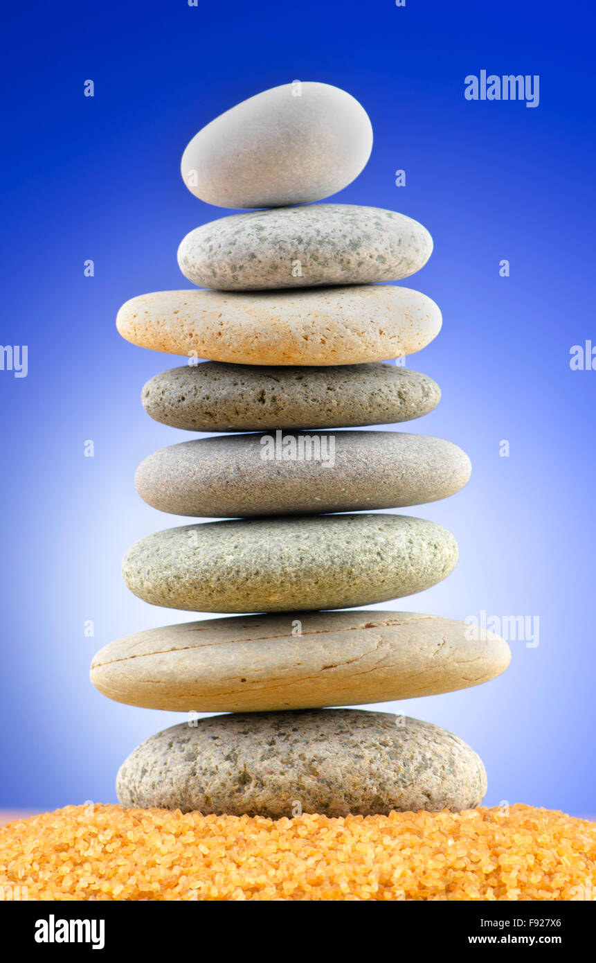 Balanced pebbles with colour background Stock Photo - Alamy