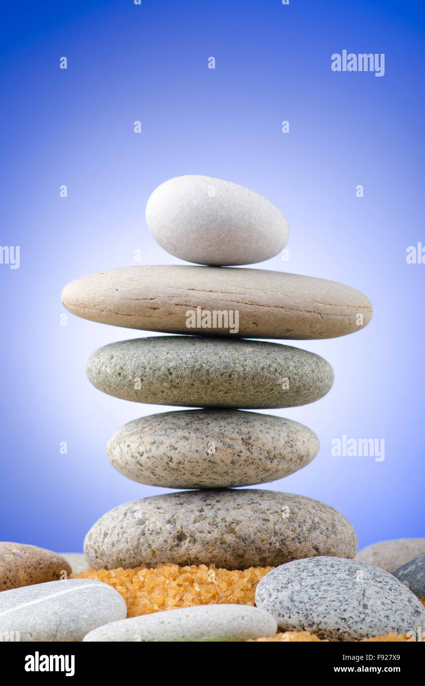 Balanced pebbles with colour background Stock Photo - Alamy