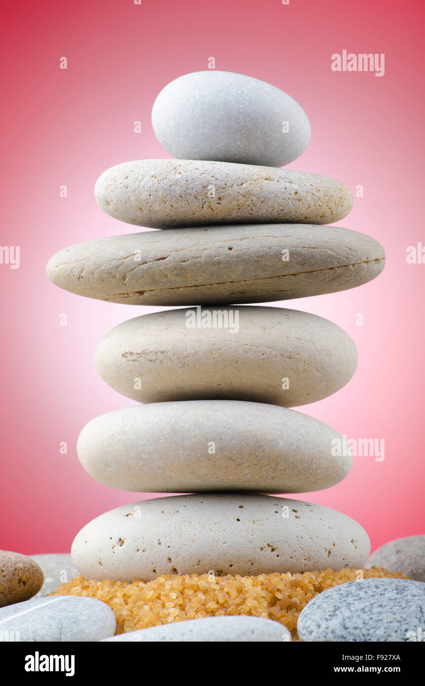 Balanced pebbles with colour background Stock Photo - Alamy