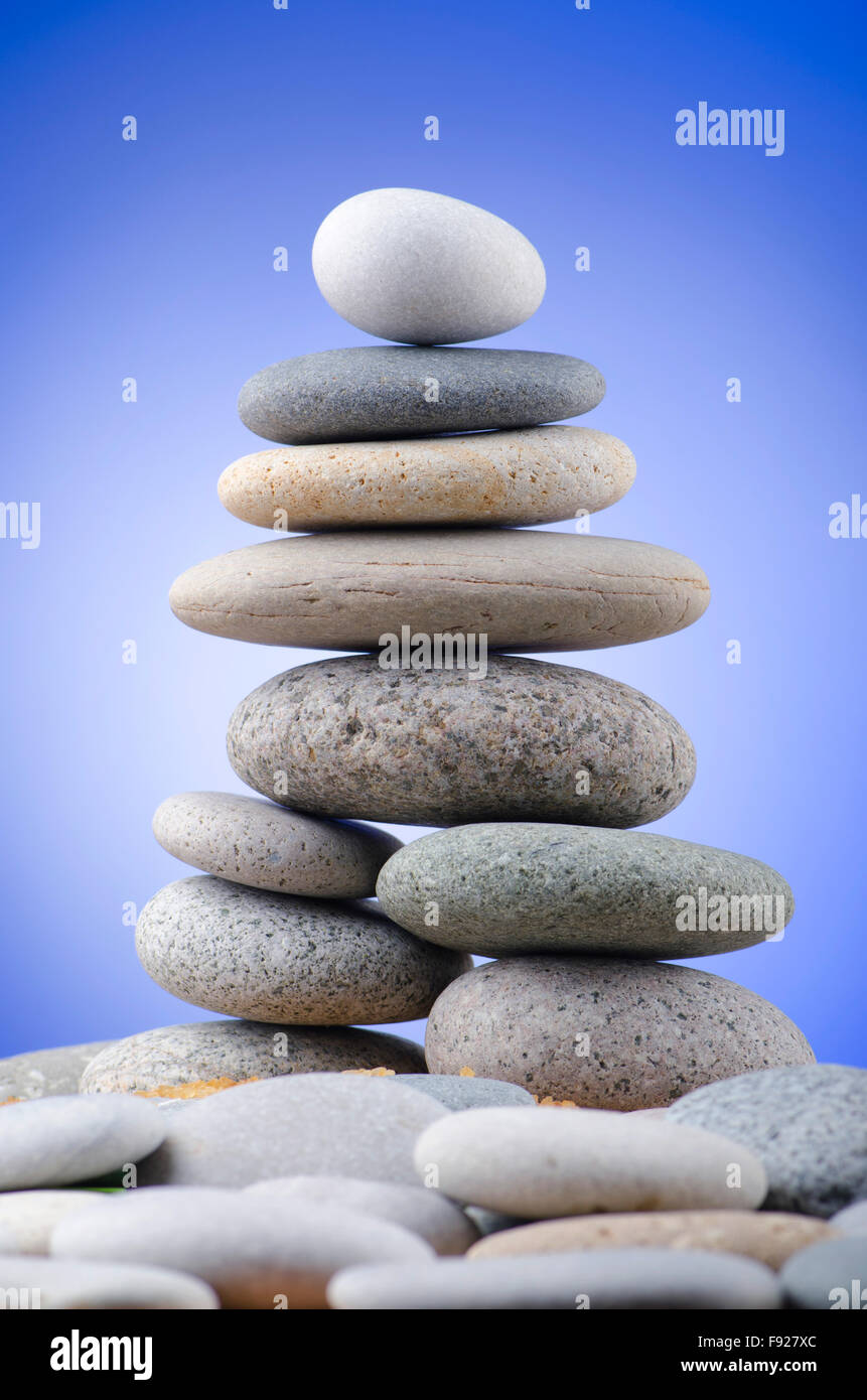 Balanced pebbles with colour background Stock Photo - Alamy