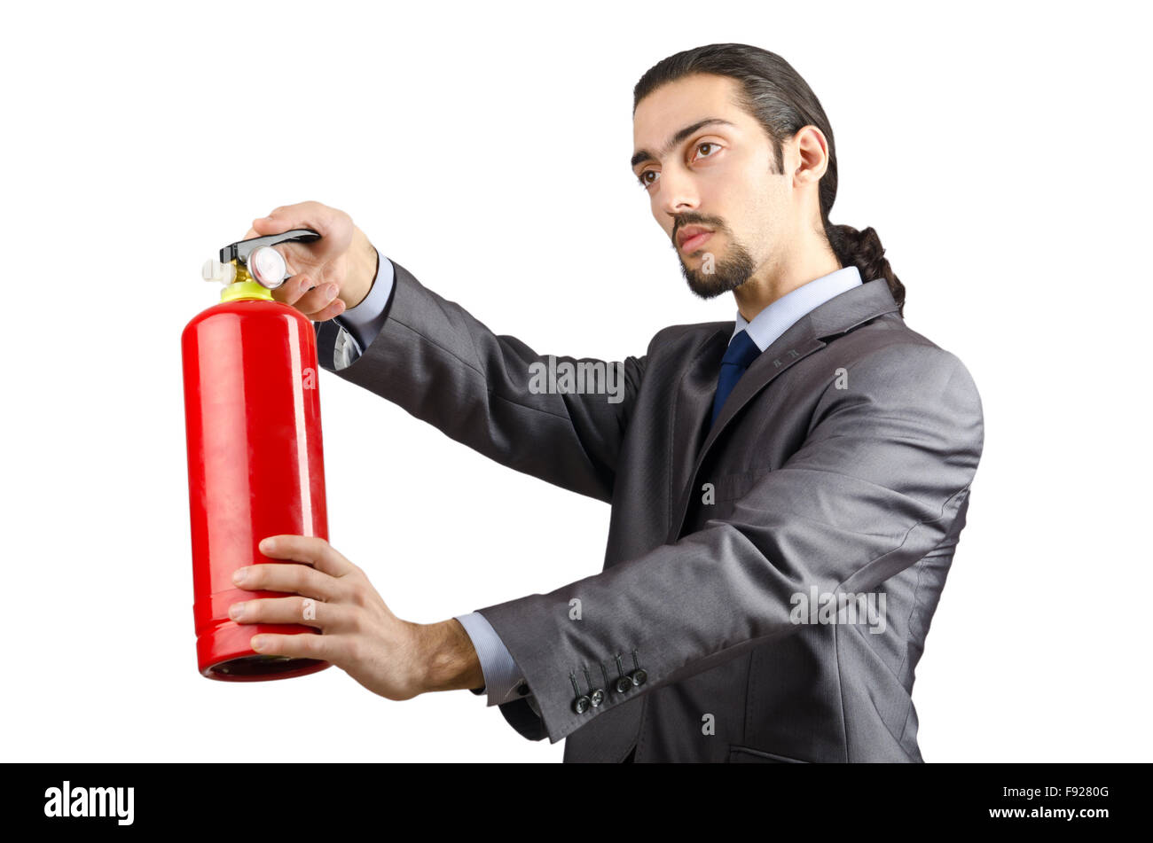 Man with fire extinguisher in firefighting concept Stock Photo - Alamy