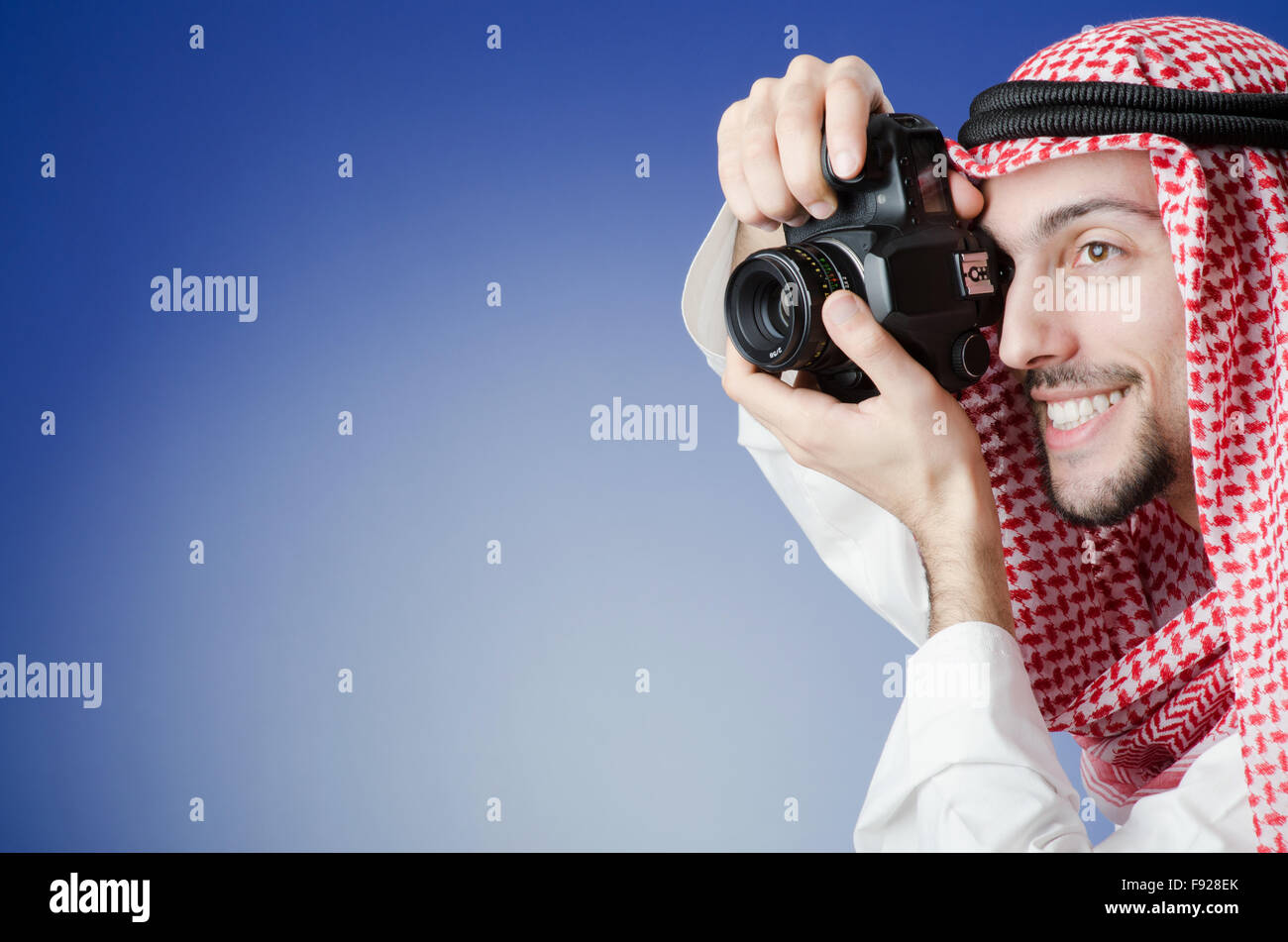 Arab photographer in studio shooting Stock Photo - Alamy