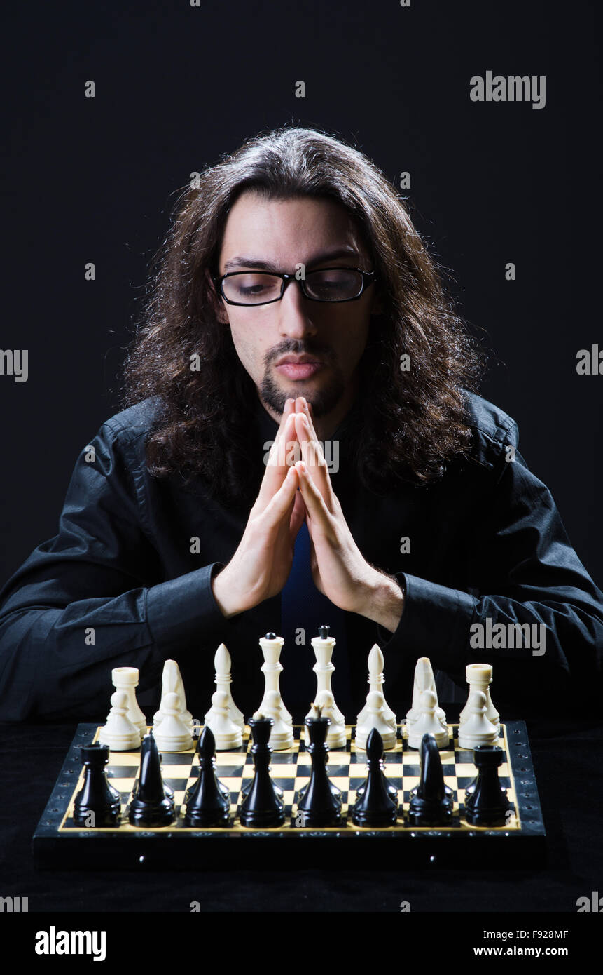 Chess player playing his game Stock Photo - Alamy