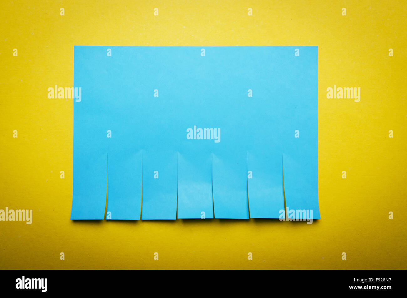 Tear off paper notice on the wall Stock Photo - Alamy