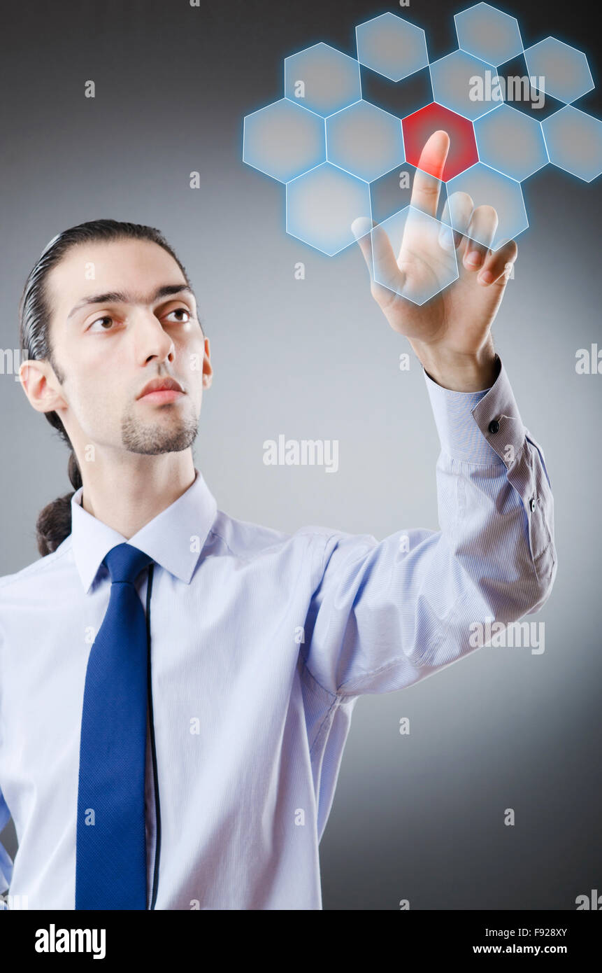 Businessman pressing virtual buttons Stock Photo - Alamy