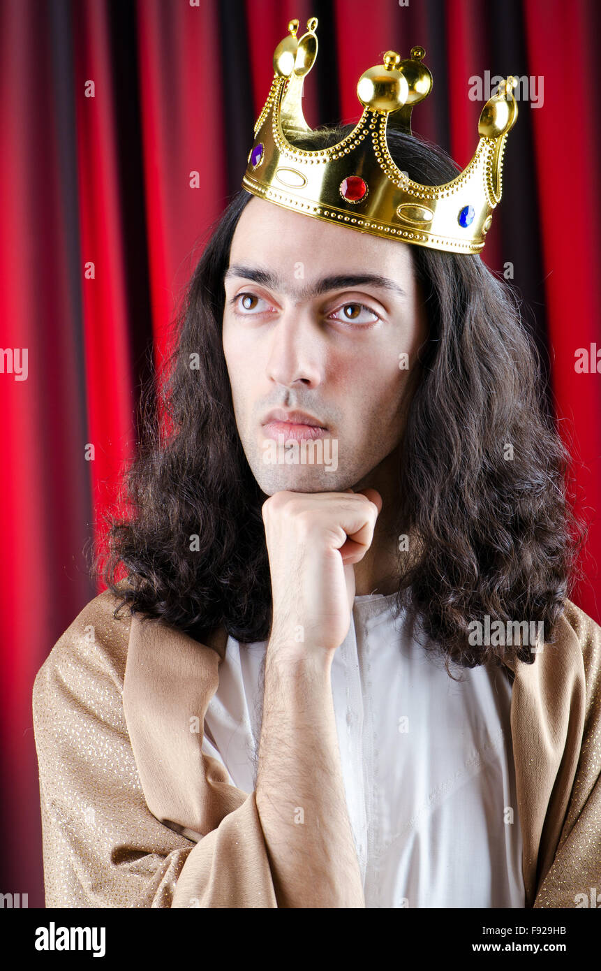 King with crown against background Stock Photo - Alamy