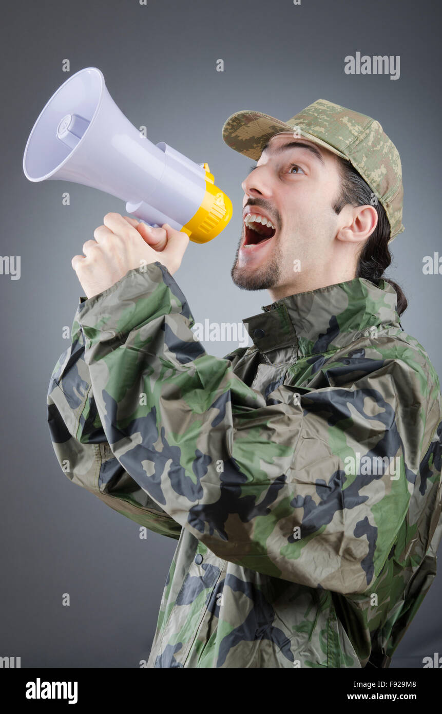 Soldier with loudspeaker shouting Stock Photo - Alamy