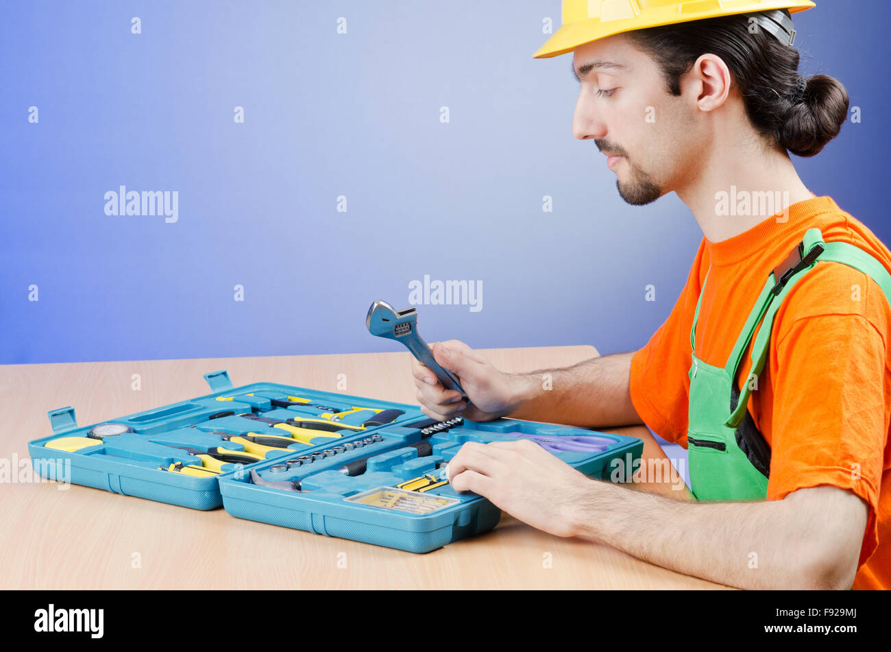 Repairman with his toolkit Stock Photo - Alamy
