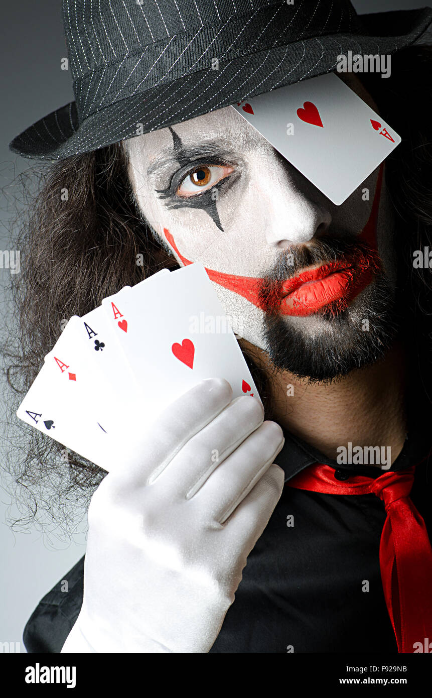 Joker with cards in studio shoot Stock Photo - Alamy