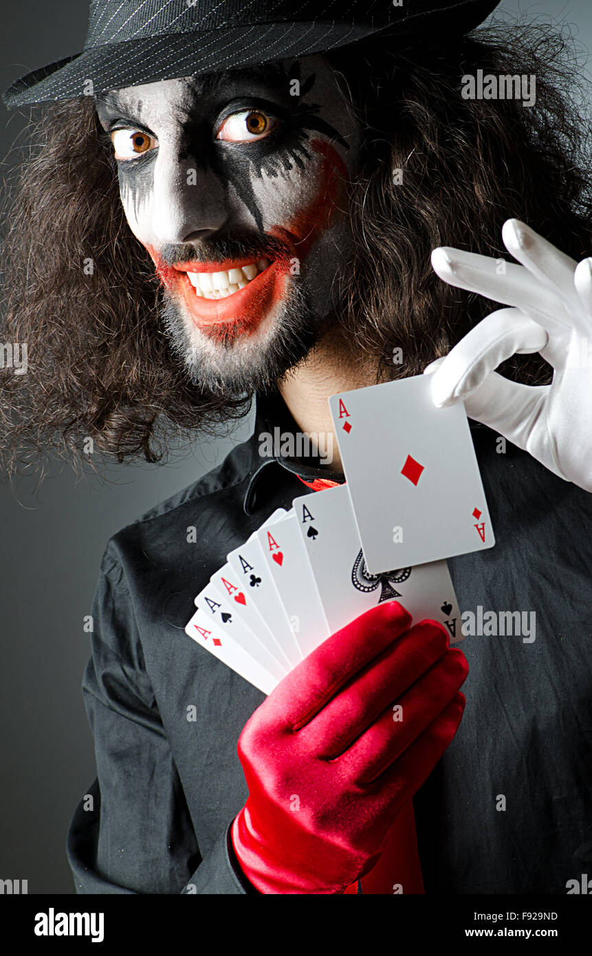 Joker with cards in studio shoot Stock Photo - Alamy