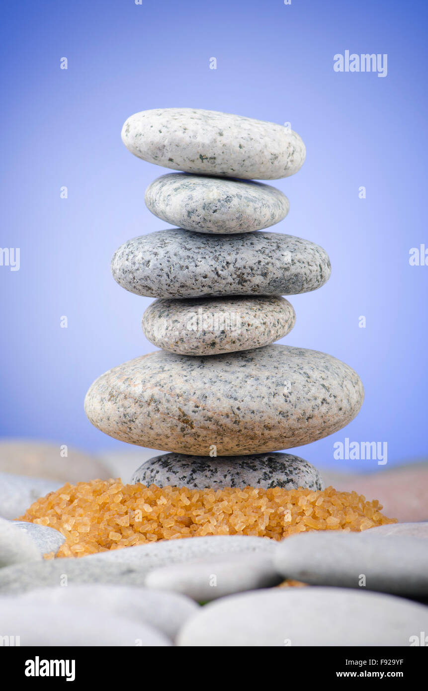 Balanced pebbles with colour background Stock Photo - Alamy
