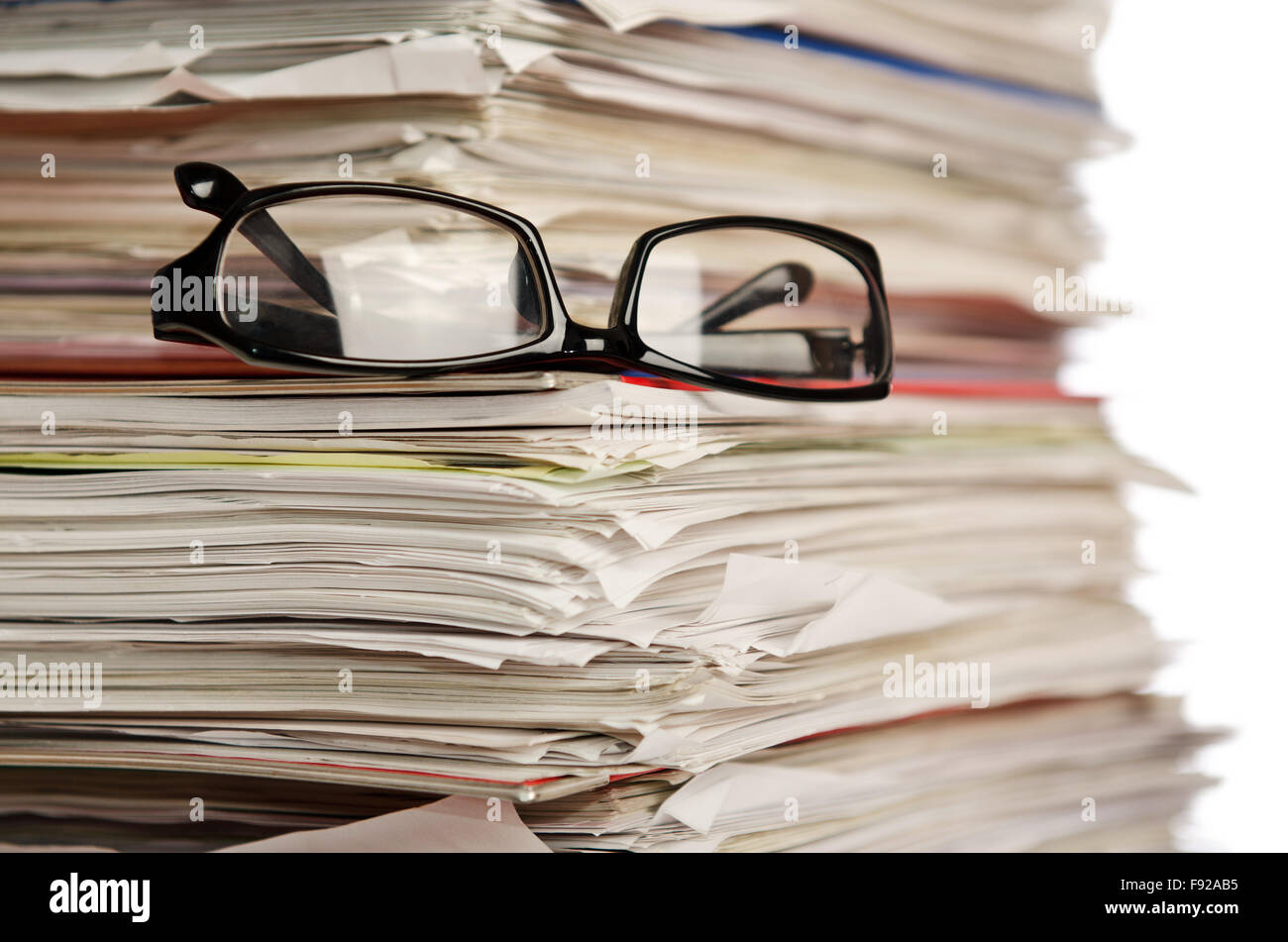 Pile of papers on white Stock Photo - Alamy