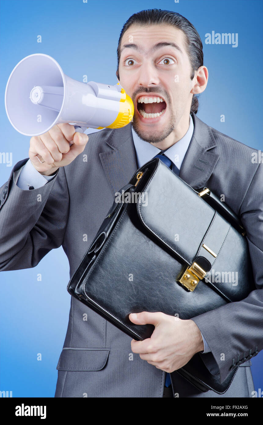 Businessman shouting via loudspeaker Stock Photo - Alamy
