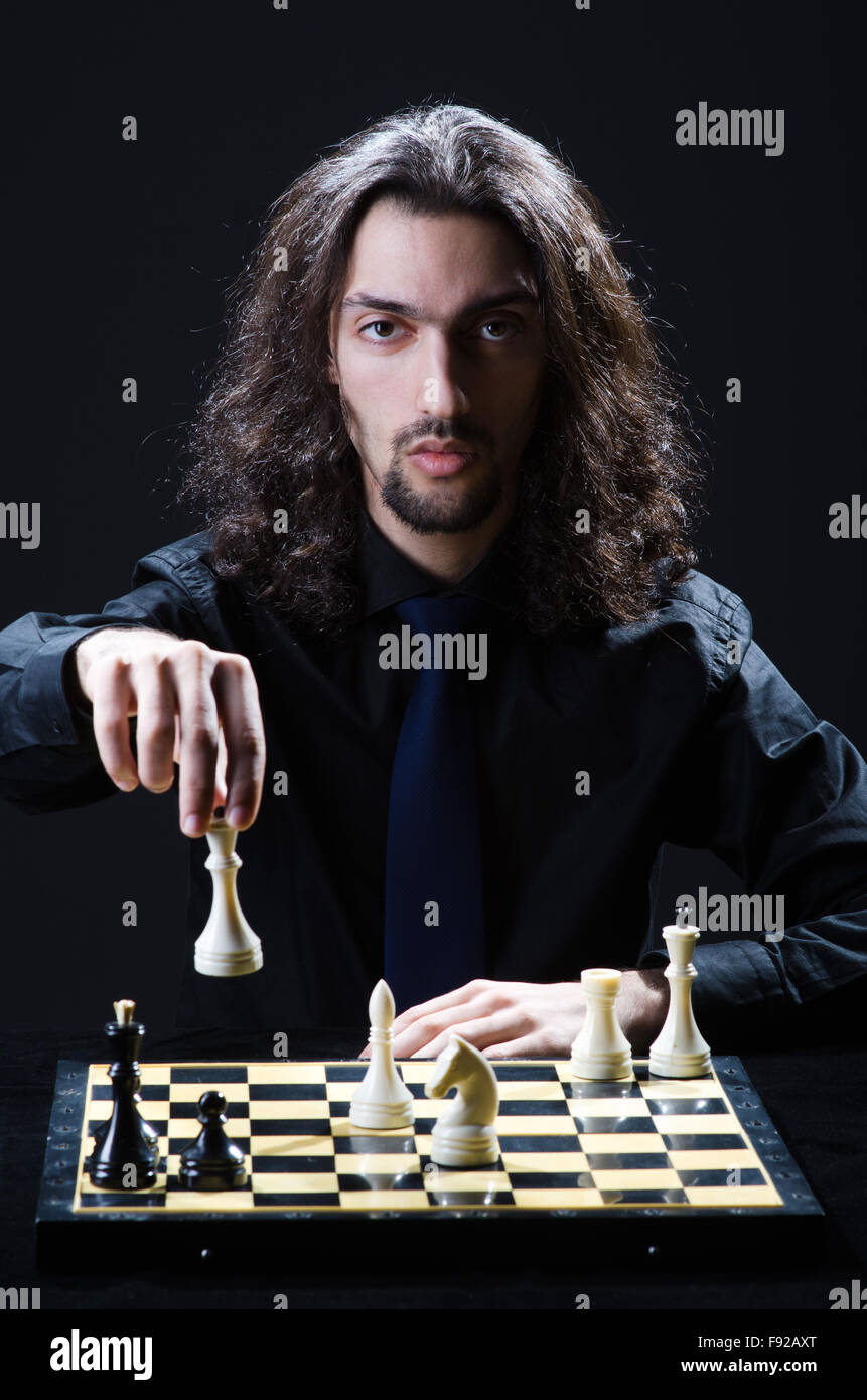 Chess player playing his game Stock Photo - Alamy