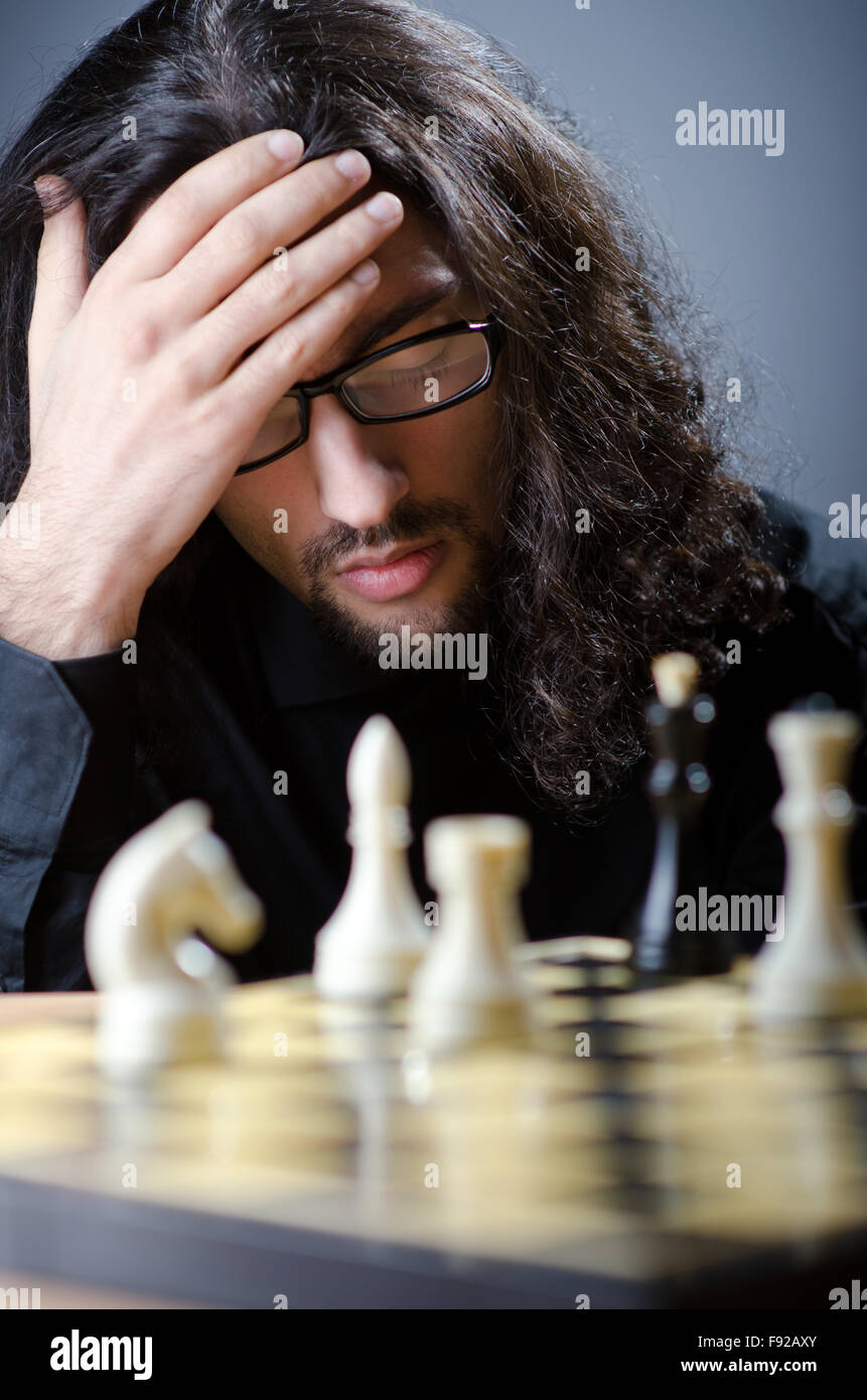 Chess player playing his game Stock Photo - Alamy