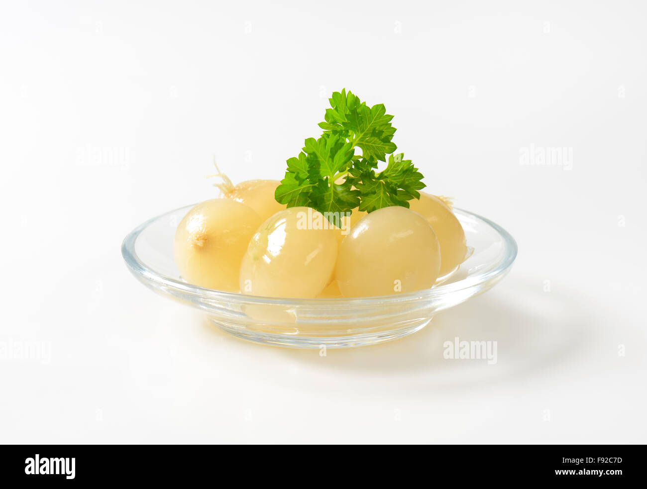 Small pickled onions on glass plate Stock Photo - Alamy