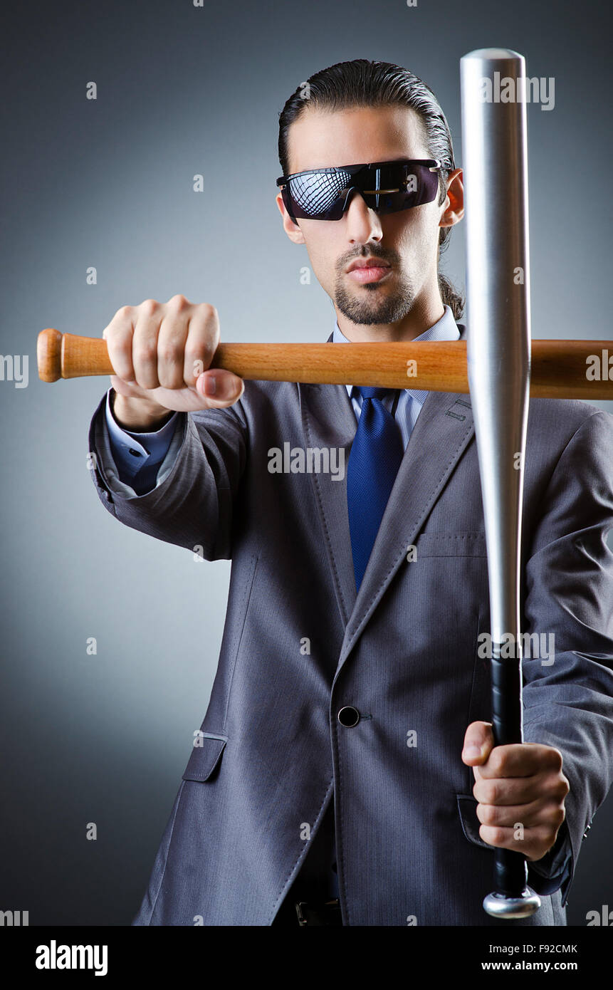 Angry businessman with bat on white Stock Photo - Alamy