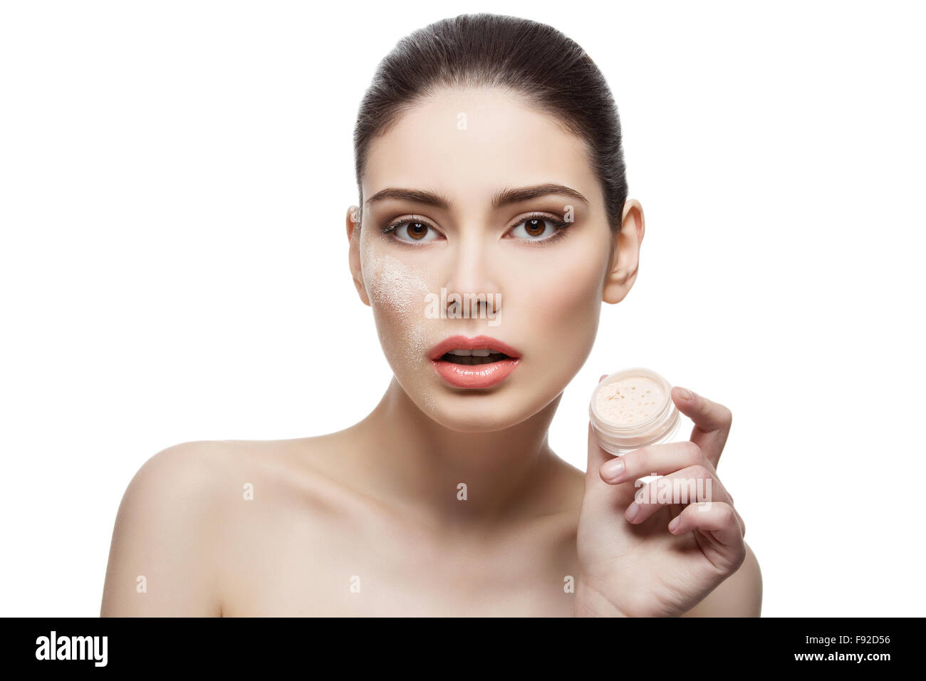 Beautiful girl holding jar with loose powder Stock Photo - Alamy