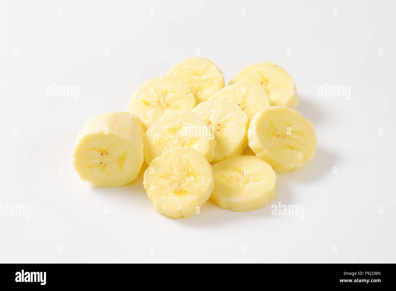 fresh banana slices on white background Stock Photo - Alamy
