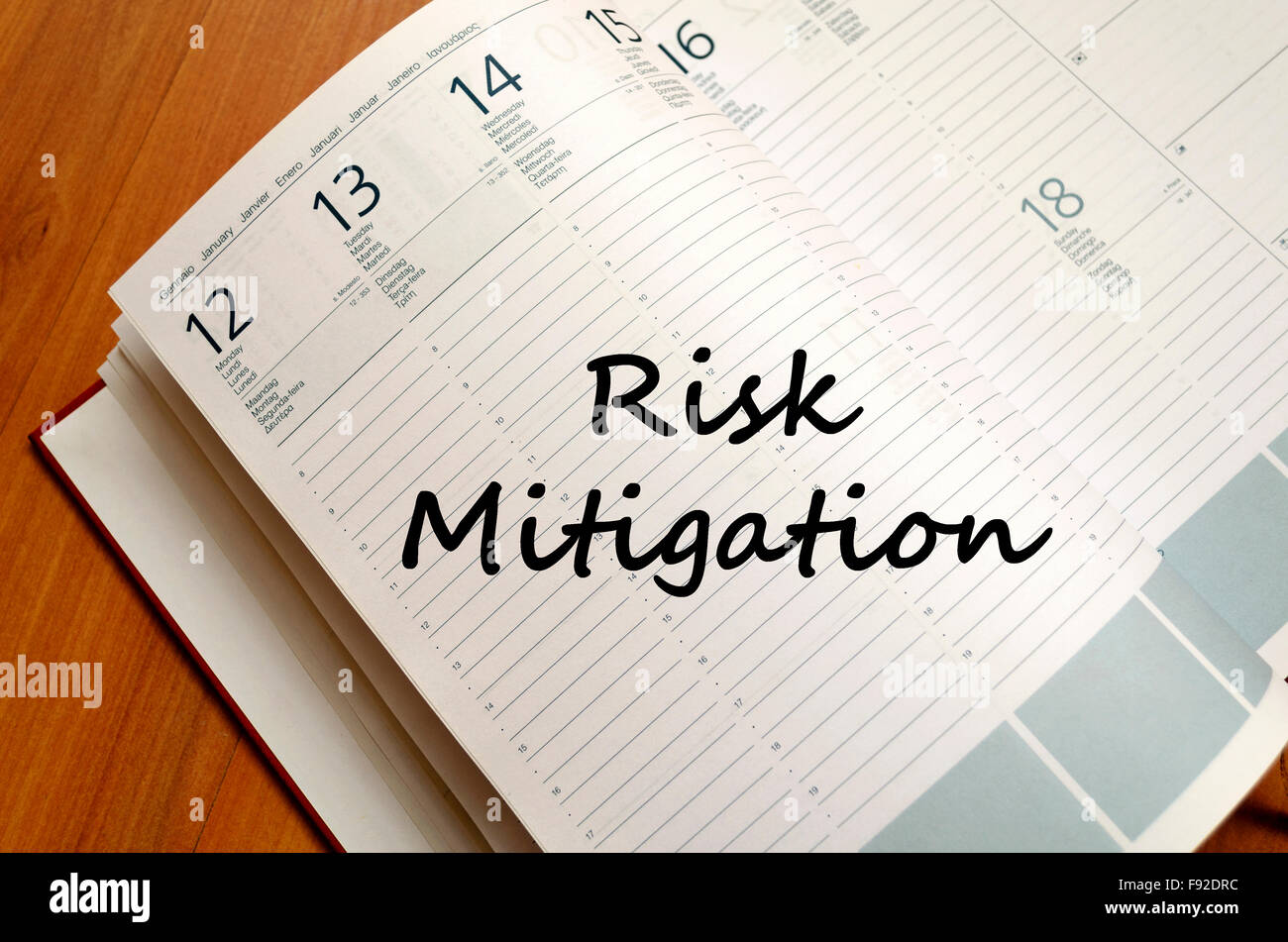 Risk mitigation text concept write on notebook with pen Stock Photo - Alamy